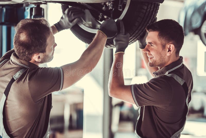 Handsome Auto Service Workers Stock Photo - Image of mechanic, station ...