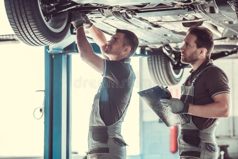 Handsome Auto Service Workers Stock Image - Image of assistant, repair ...