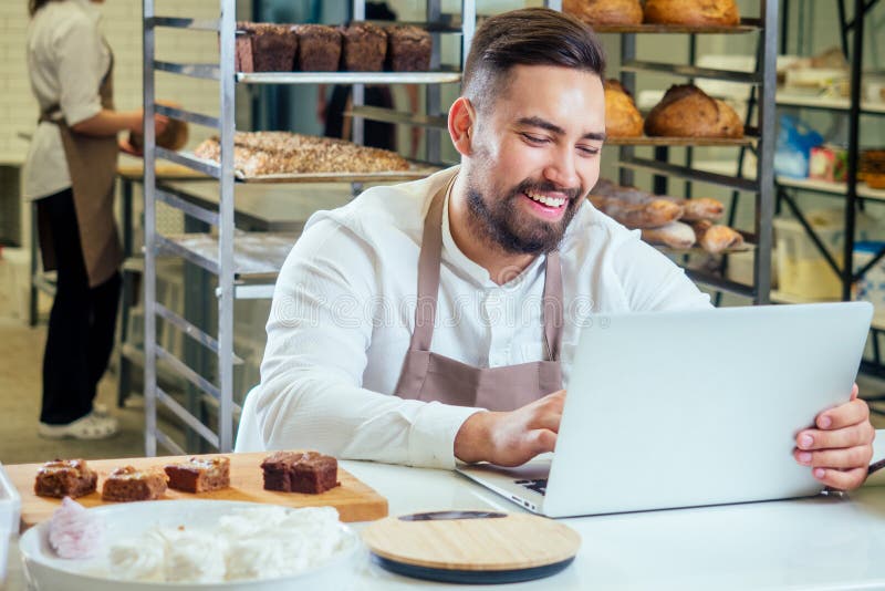Handsome Baker in Uniform at the Manufacturing Small Business Owner ...