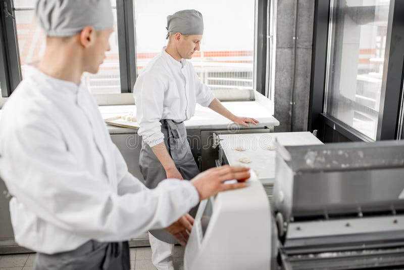 Bakers Rolling Dough at the Manufacturing Stock Photo - Image of ...