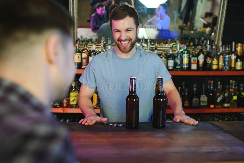 Handsome Bar Tender Standing Behind His Counter in a Pub Stock Image ...