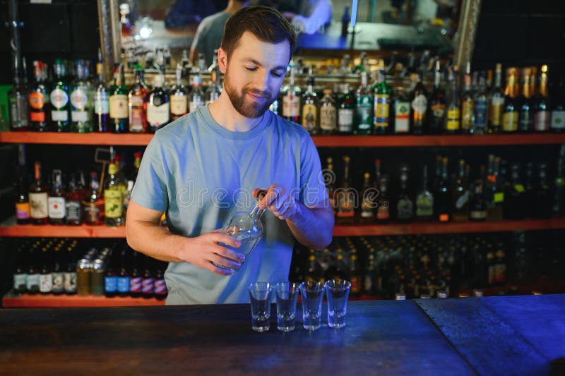 Handsome Bar Tender Standing Behind His Counter in a Pub Stock Photo ...