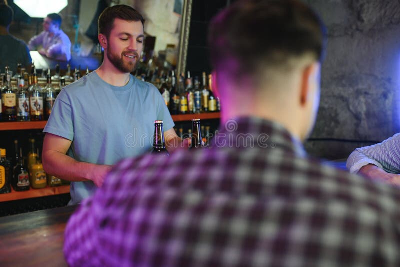 Handsome Bar Tender Standing Behind His Counter in a Pub Stock Image ...