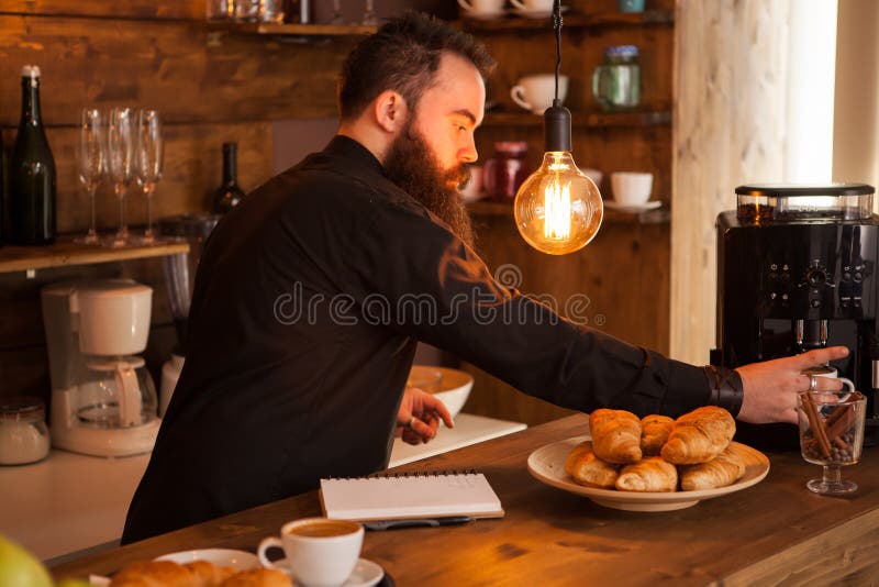 Handsome Barman Behind a Bar with a Prepared Coffee. Stock Image ...