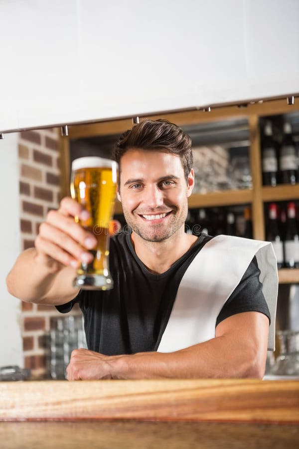 Handsome Barman Holding a Pint of Beer Stock Image - Image of barman ...