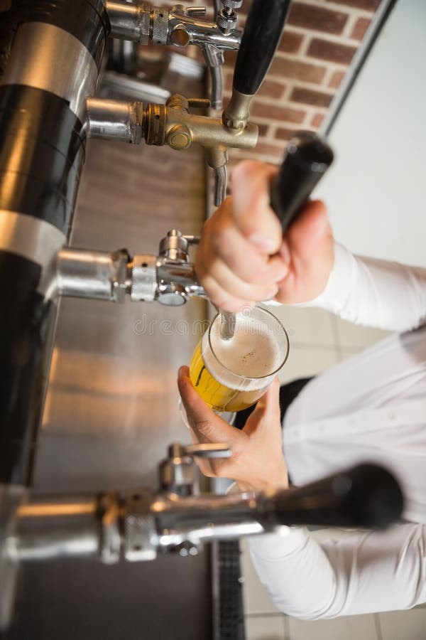 Handsome Barman Pouring a Pint of Beer Stock Image - Image of person ...