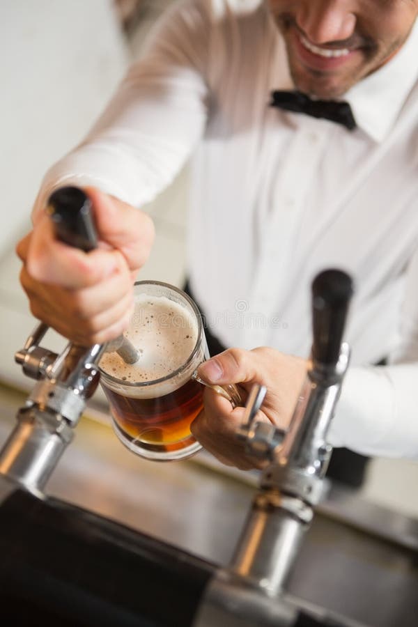 Handsome Barman Pouring a Pint of Beer Stock Photo - Image of happy ...
