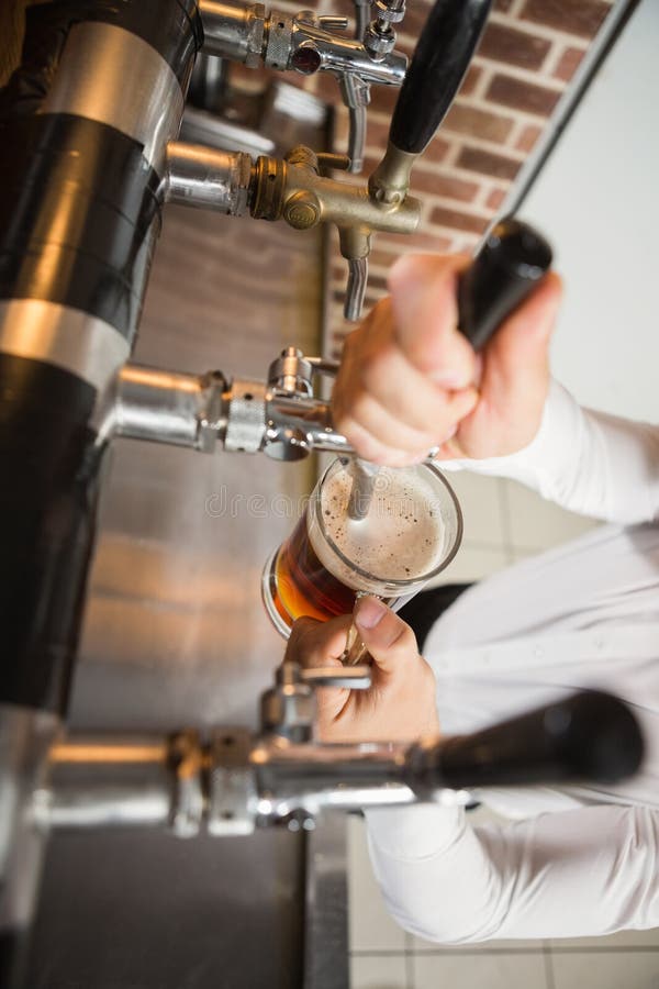 Handsome Barman Pouring a Pint of Beer Stock Photo - Image of caucasian ...