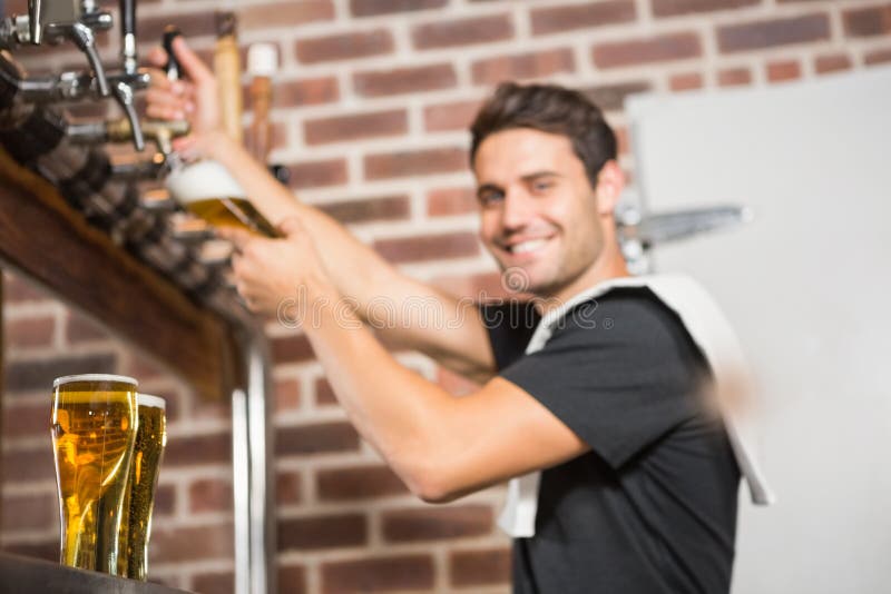 Handsome Barman Pouring a Pint of Beer Stock Image - Image of handsome ...