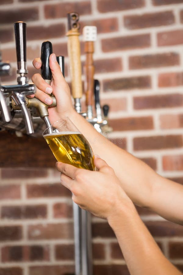 Handsome Barman Pouring a Pint of Beer Stock Image - Image of male ...