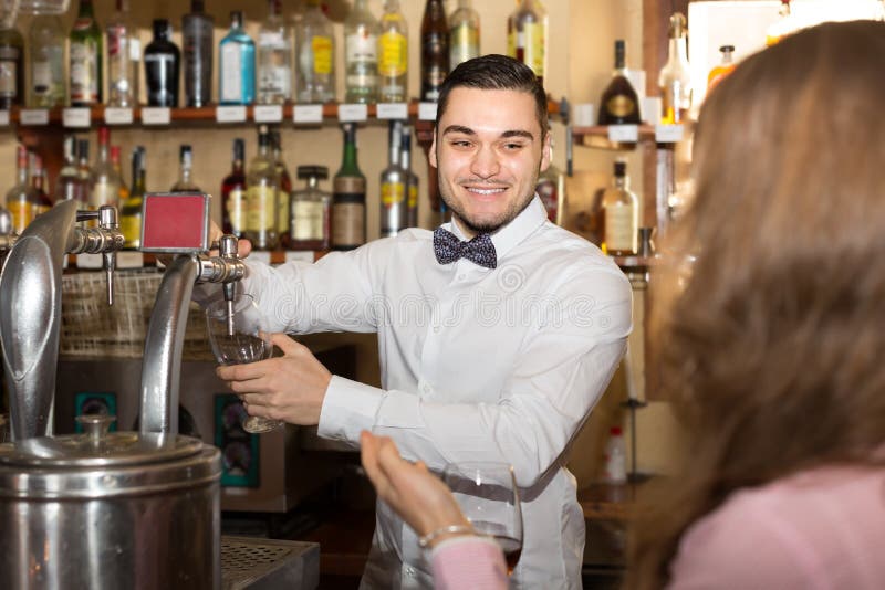 Handsome bartender at bar stock image. Image of brunet - 52618967
