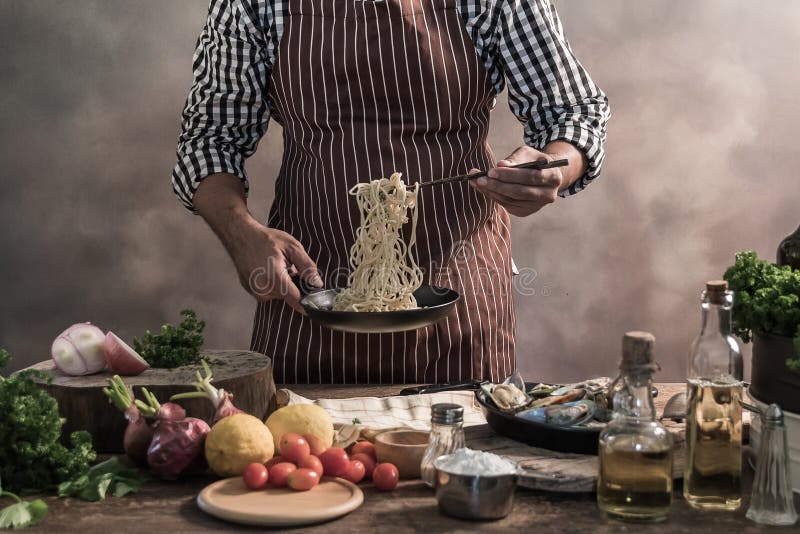 Handsome Bearded Cheef Cook Prepairing Spaghetti on a Kitchen Stock ...