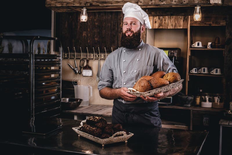 Handsome Bearded Chef in Uniform Showing Tray of Fresh Bread in the ...