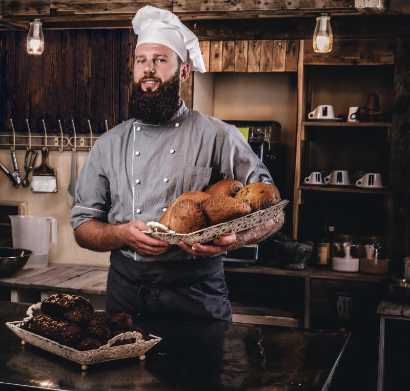 Handsome Bearded Chef in Uniform Showing Tray of Fresh Bread in the ...