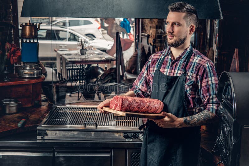 A Man Holds Beef Steak on a Kitchen. Stock Image - Image of chef ...