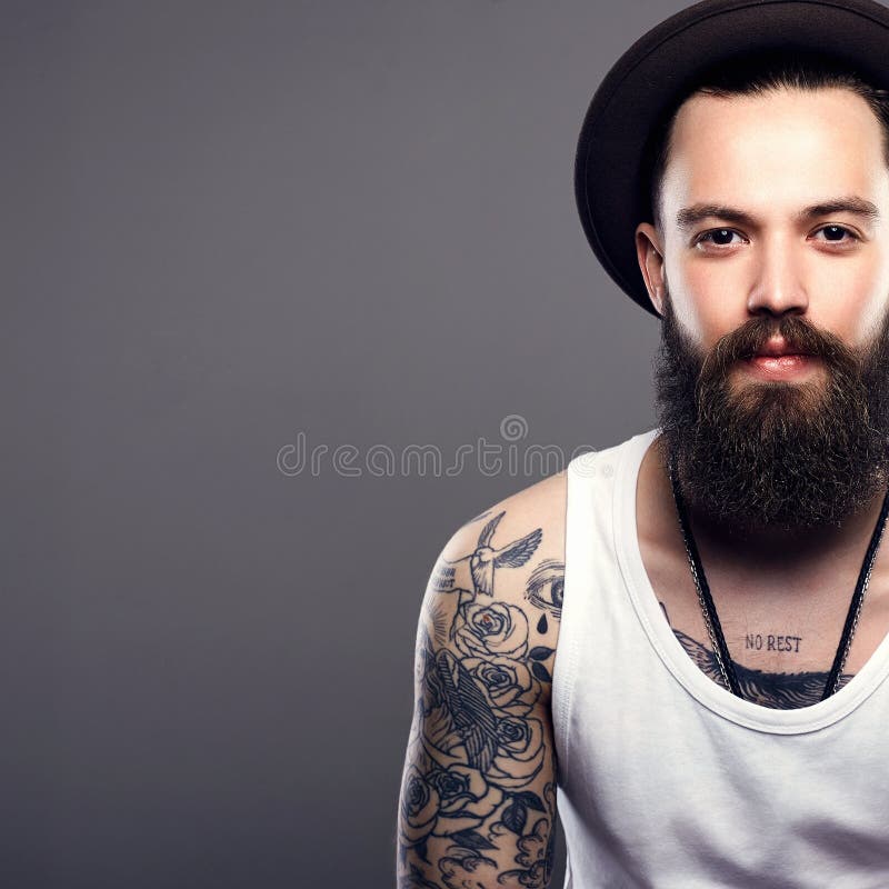 Handsome Bearded Man in Hat. Tattoo on the Hand Stock Image - Image of ...
