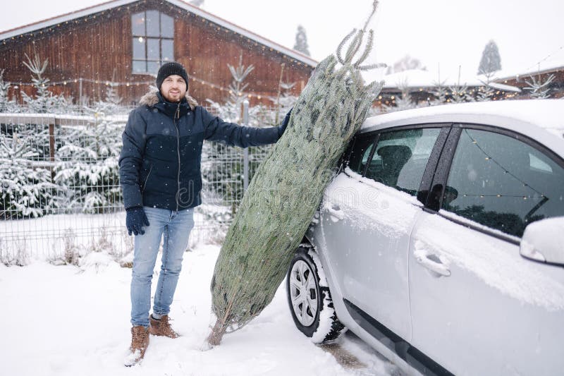 Handsome Bearded Man Stand by the Car and Think How To Put a Christmas ...