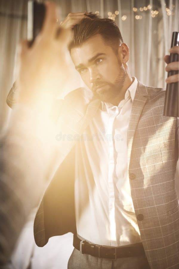 Handsome and Bearded Man is Using Hairspray Stock Photo - Image of ...