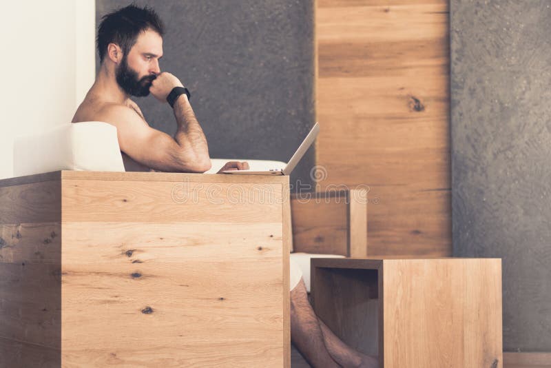 Handsome Bearded Man Using Laptop Computer while Resting in Spa Hotel ...
