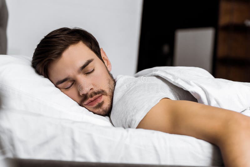 Bearded Man Sleeping on White Bedding at Home. Stock Image - Image of ...