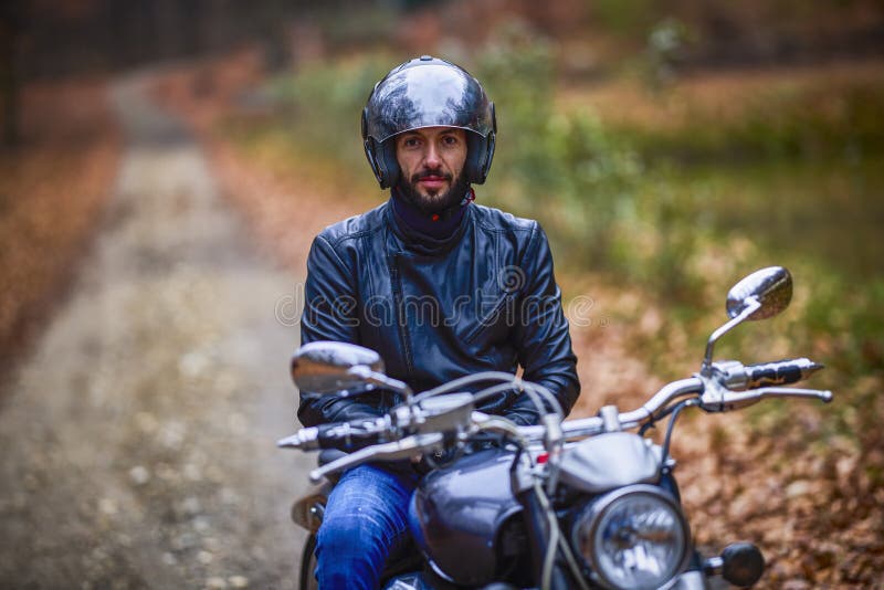 Handsome Biker in the Forest. Stock Photo - Image of outdoor, adventure ...