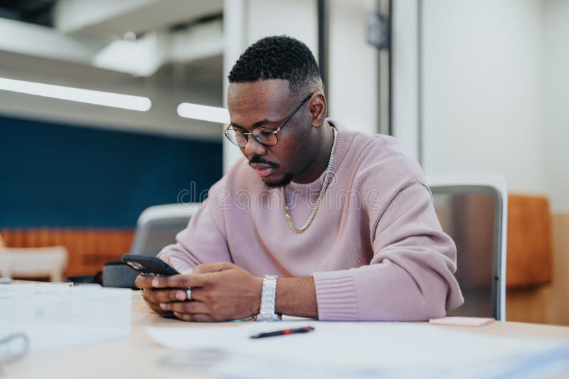 Handsome Black Male Checking His Phone. Stock Photo - Image of workshop ...