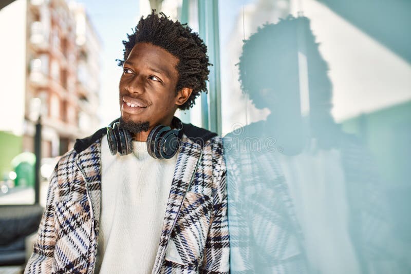 Handsome Black Man with Afro Hair Wearing Headphones Smiling Happy ... Handsome Black Man with Afro Hair Wearing Headphones Smiling Happy ...