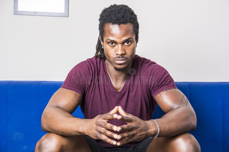 Handsome Black Man Sitting on Couch Stock Photo - Image of appealing ... Handsome Black Man Sitting on Couch Stock Photo - Image of appealing ...