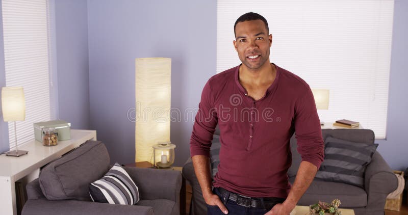 Handsome Black Man Standing in Living Room Stock Image - Image of ...