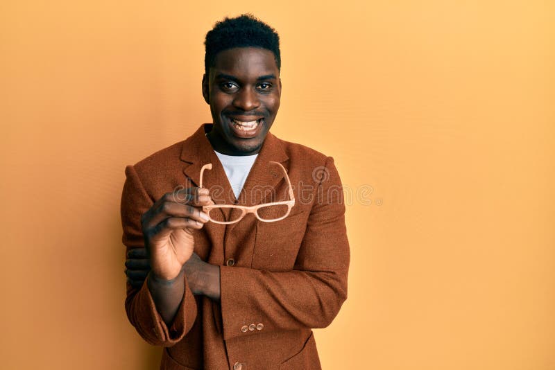 Handsome Black Man Wearing Elegant Clothes And Glasses Celebrating