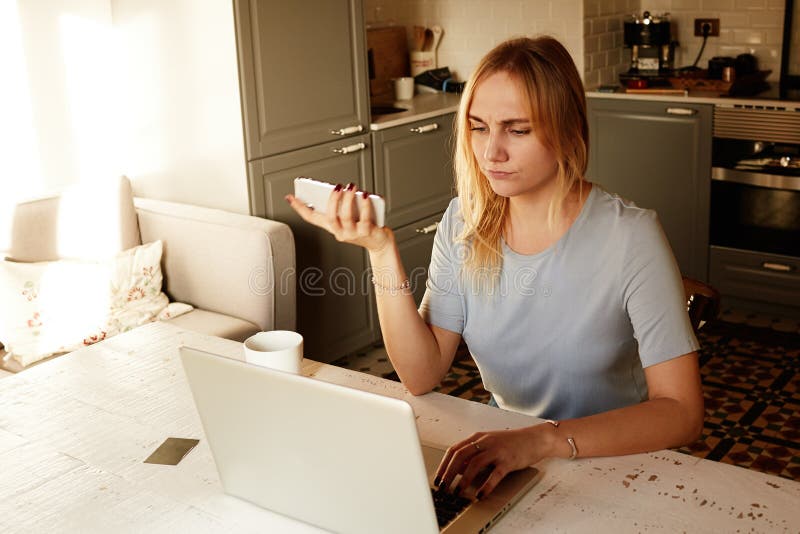Handsome Blond Girl Working at Home on Laptop. Stock Image - Image of ...
