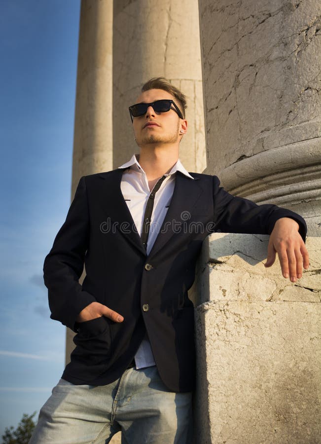 Handsome Blond Young Man with Marble Columns Behind Him Stock Image ...
