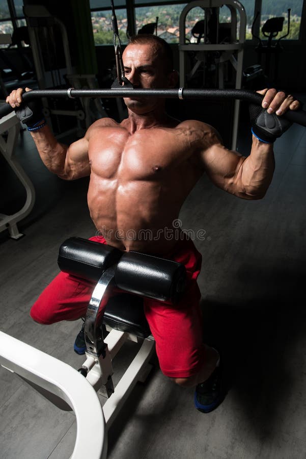 Muscular Man Doing Heavy Weight Exercise for Back Stock Photo - Image ...