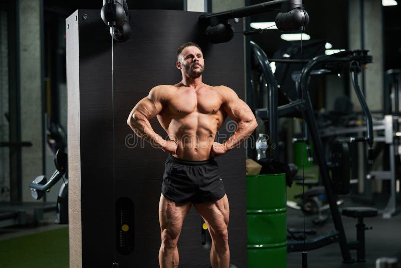 Handsome Bodybuilder Performing Front Lat Spread Pose. Stock Image ...