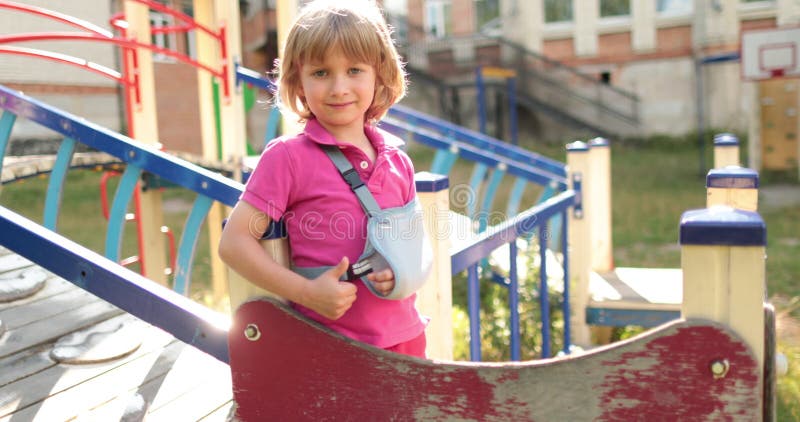 A Handsome Boy with a Broken Arm in a Bandage. Stock Footage - Video of broken, bone: 298645856