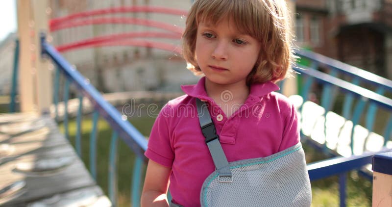 A Handsome Boy with a Broken Arm in a Bandage. Stock Footage - Video of broken, bone: 298645856