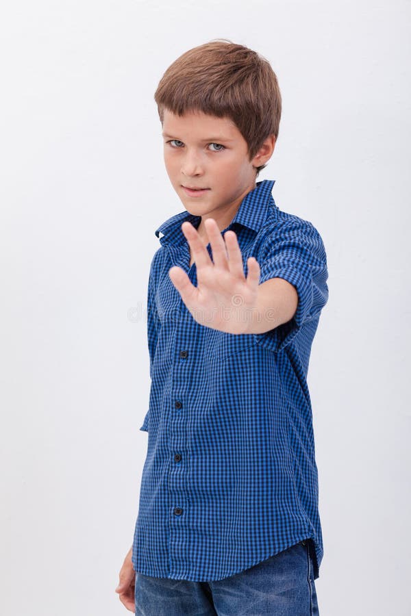 Boy stop sign stock photo. Image of gesture, isolated - 20982046
