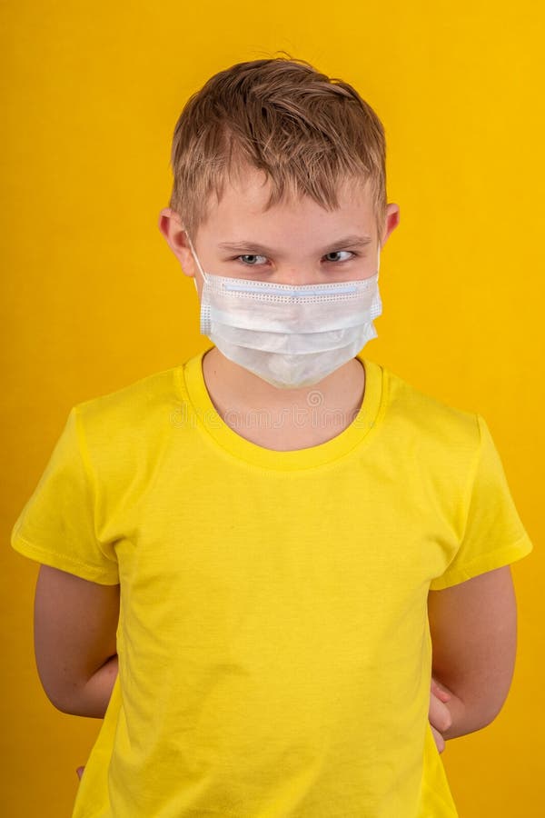 Handsome Boy in Protective Mask on a Yellow Background Stock Image ...