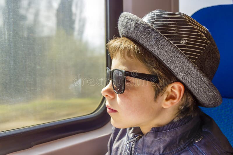 Handsome Boy in Sunglasses Rides on a Train Stock Image - Image of ...