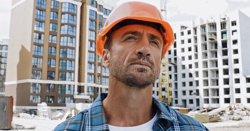 Handsome Builder Looking Away on Construction Stock Image - Image of ...