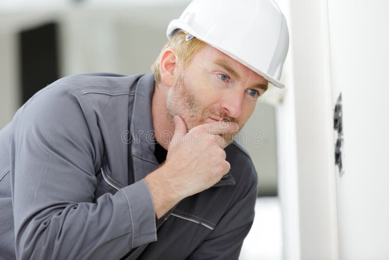 Handsome Builder Thinking about Something Stock Photo - Image of ...