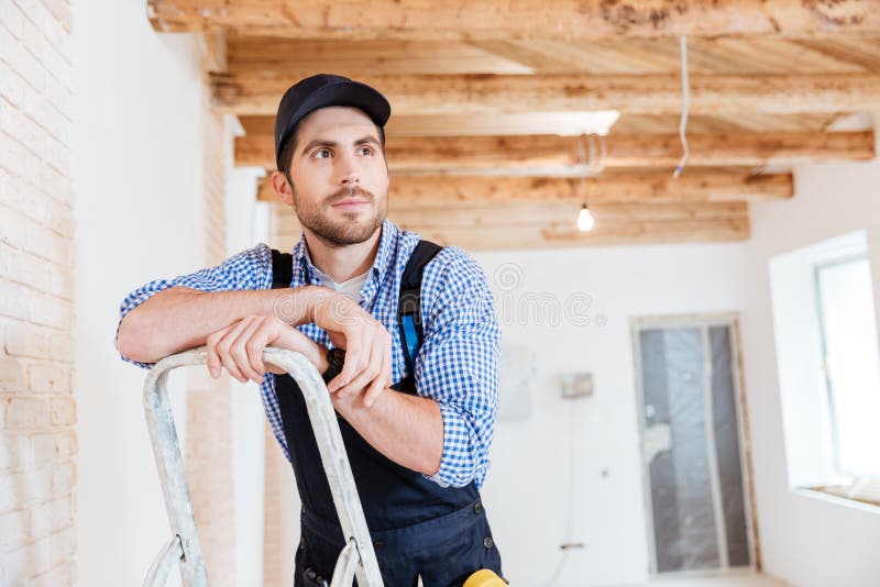 Handsome Builder Thinking about Something while Working Stock Image ...