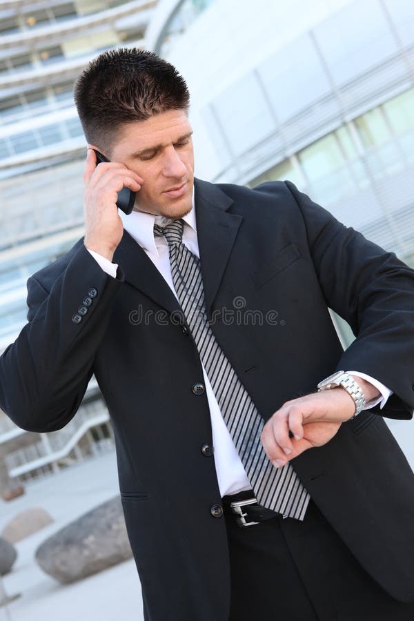 Handsome Business Man Looking at Watch Stock Photo - Image of cell ...