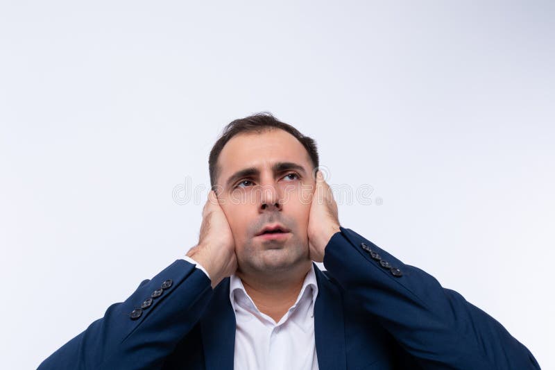 Handsome Business Man in a Stylish Blue Jacket Covers His Ears with His ...