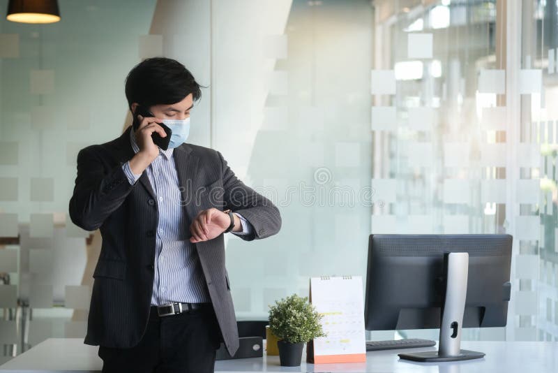 Handsome Businessman Checking Time and Looking at Wrist Watch while ...