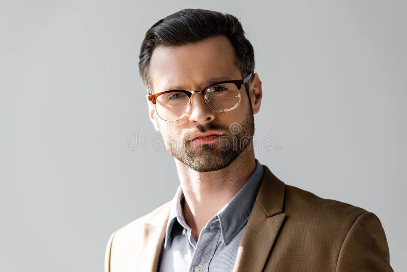 Businessman In Glasses Looking At Camera Isolated On Grey Stock Image