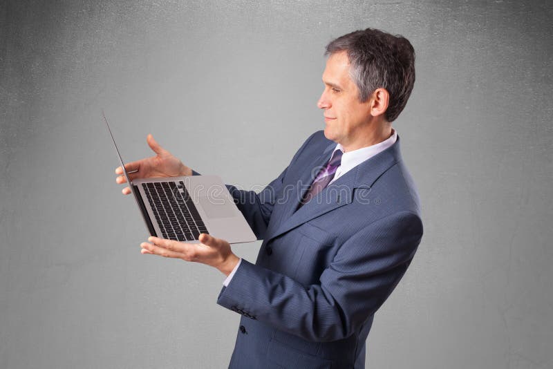 Businessperson Holding an Open Laptop with Thumb Up Stock Photo - Image ...