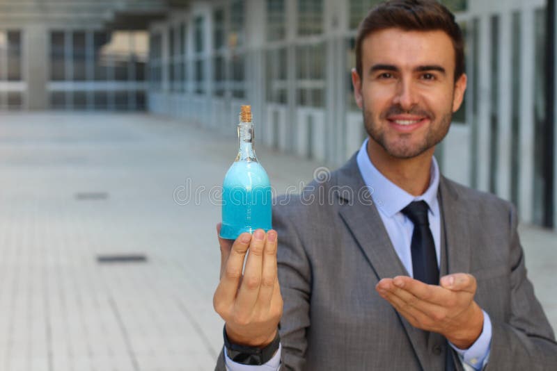 Handsome Businessman Holding a Potion Stock Photo - Image of hand, life ...