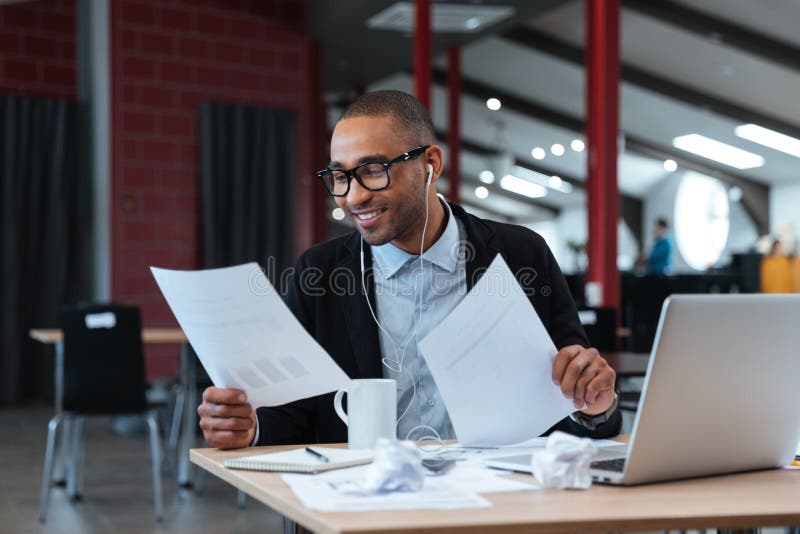 Handsome Businessman Looking at Documents Stock Image - Image of ...