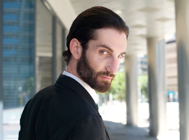 Handsome Businessman Looking Over Shoulder Stock Image - Image of ...